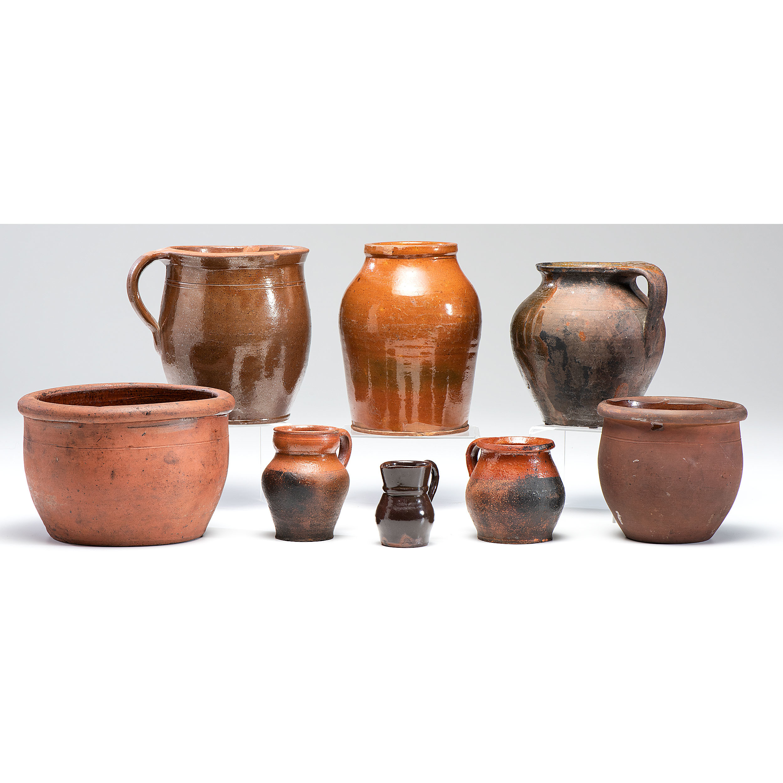 Eight Redware Vessels | Barnebys
